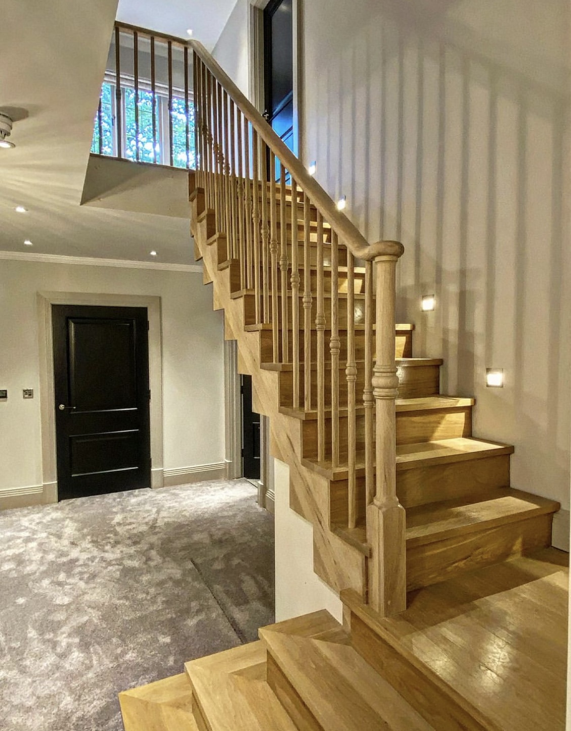 gallery featuring stairs and spindles